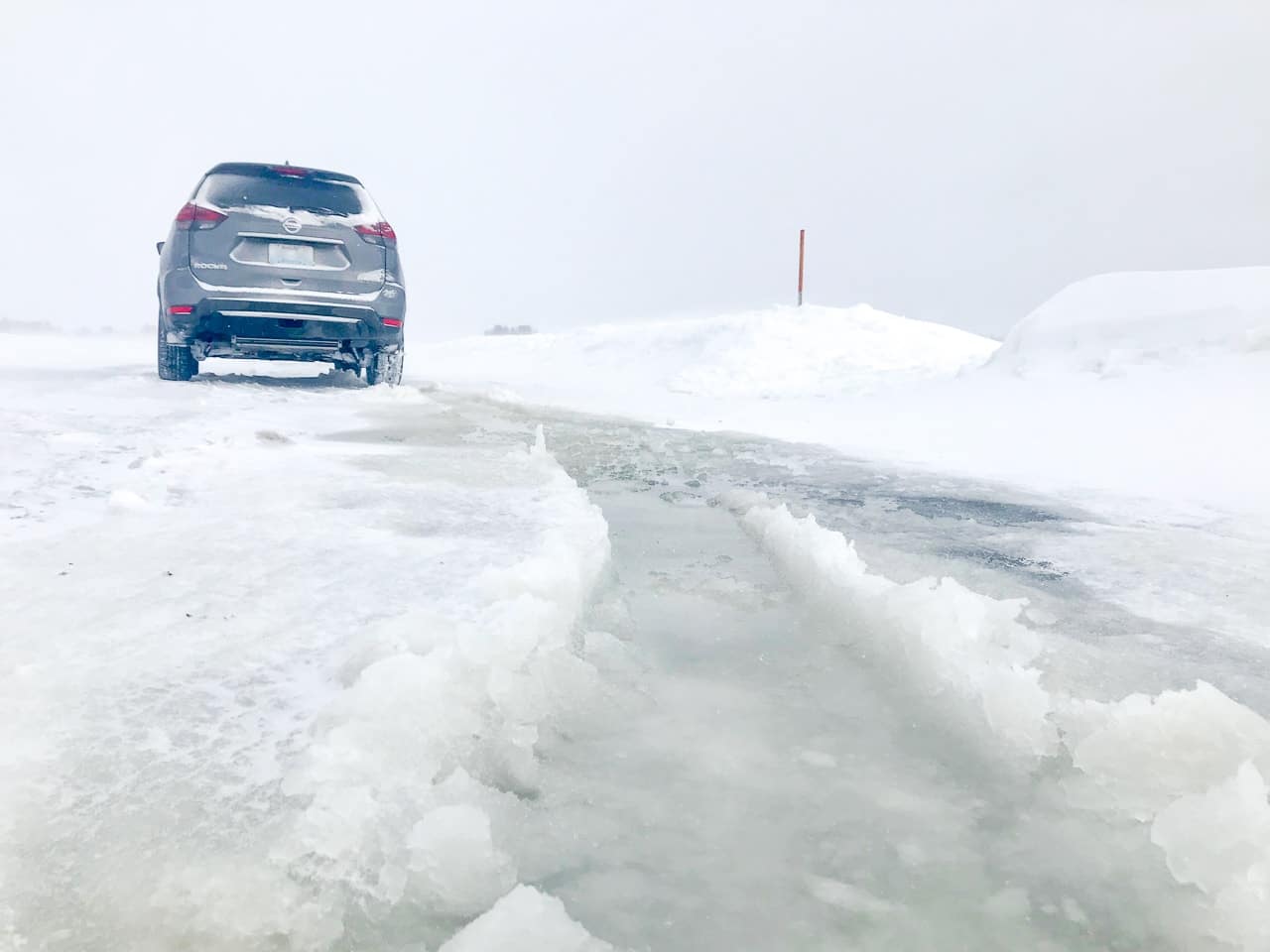 Want a unique winter thrill? Try driving an ice road across a frozen ...